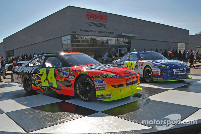 Hendrick Motorsports race shop with show cars in front of one building ...